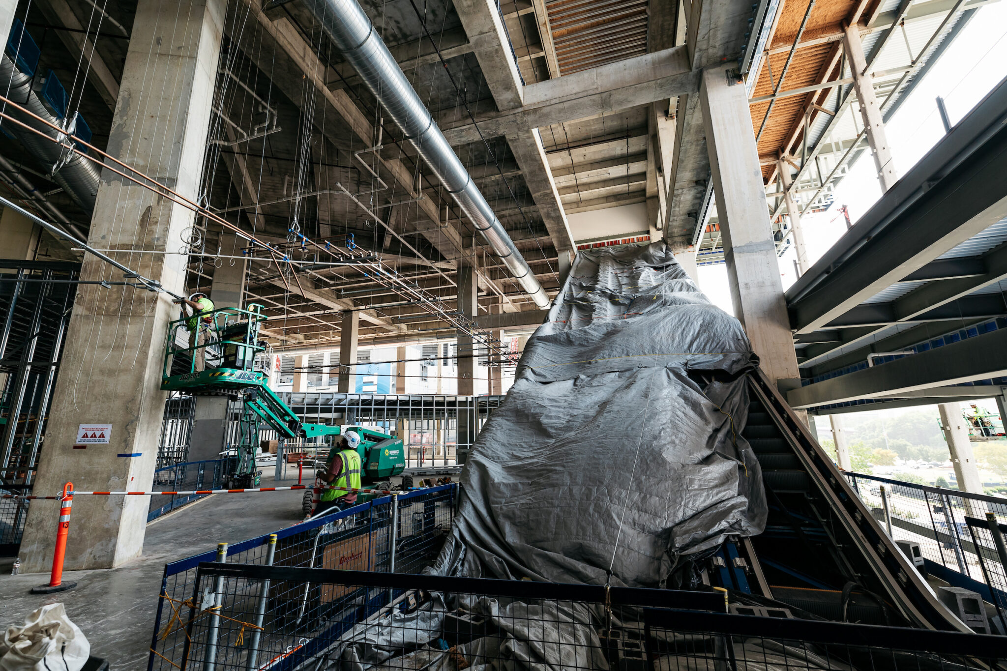 12,000 Steel Beams, 1,600 Glass Panels, 44 Escalators, 27 Elevators ...